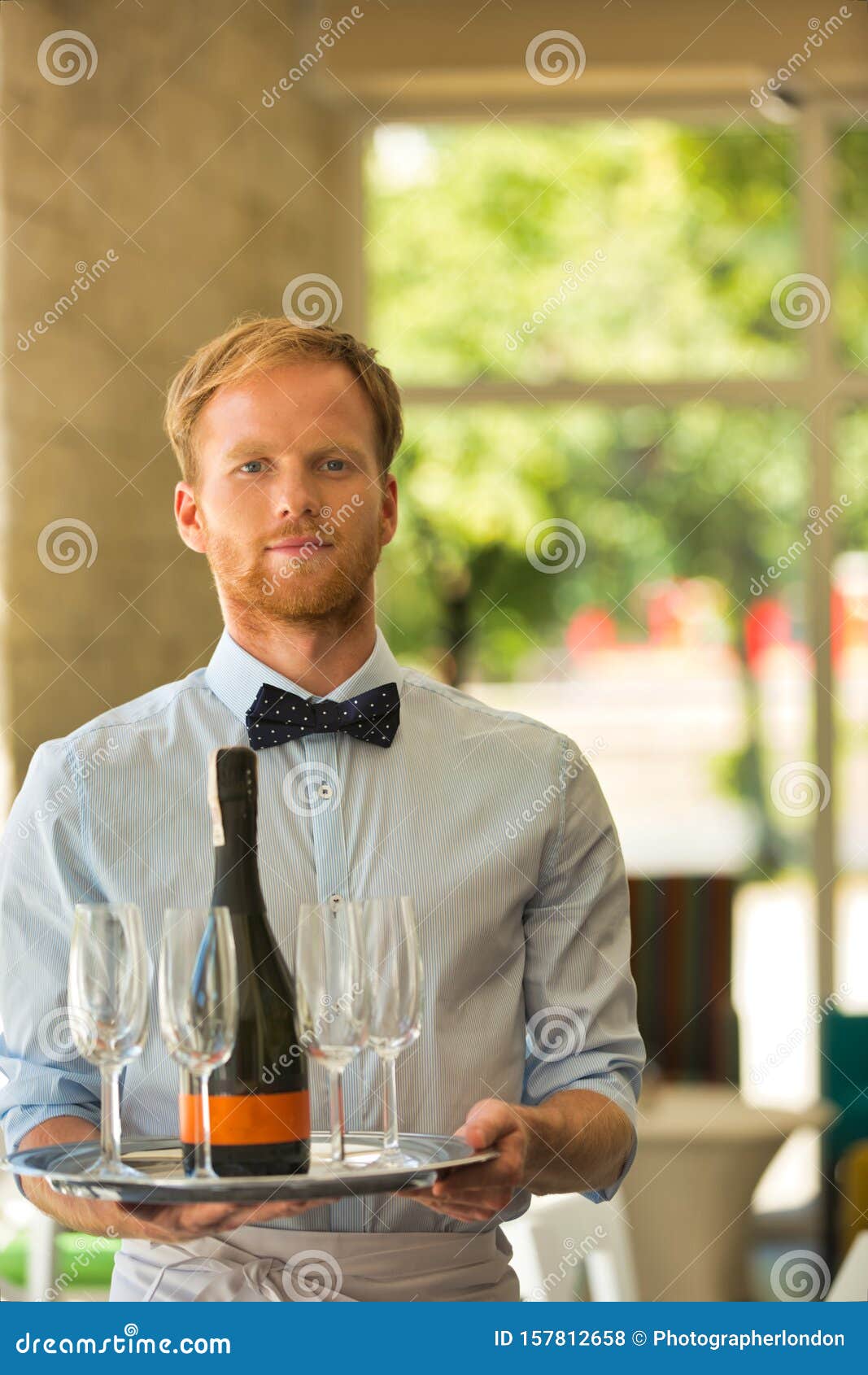 Portrait of Confident Young Waiter Serving Wine at Restaurant Stock ...