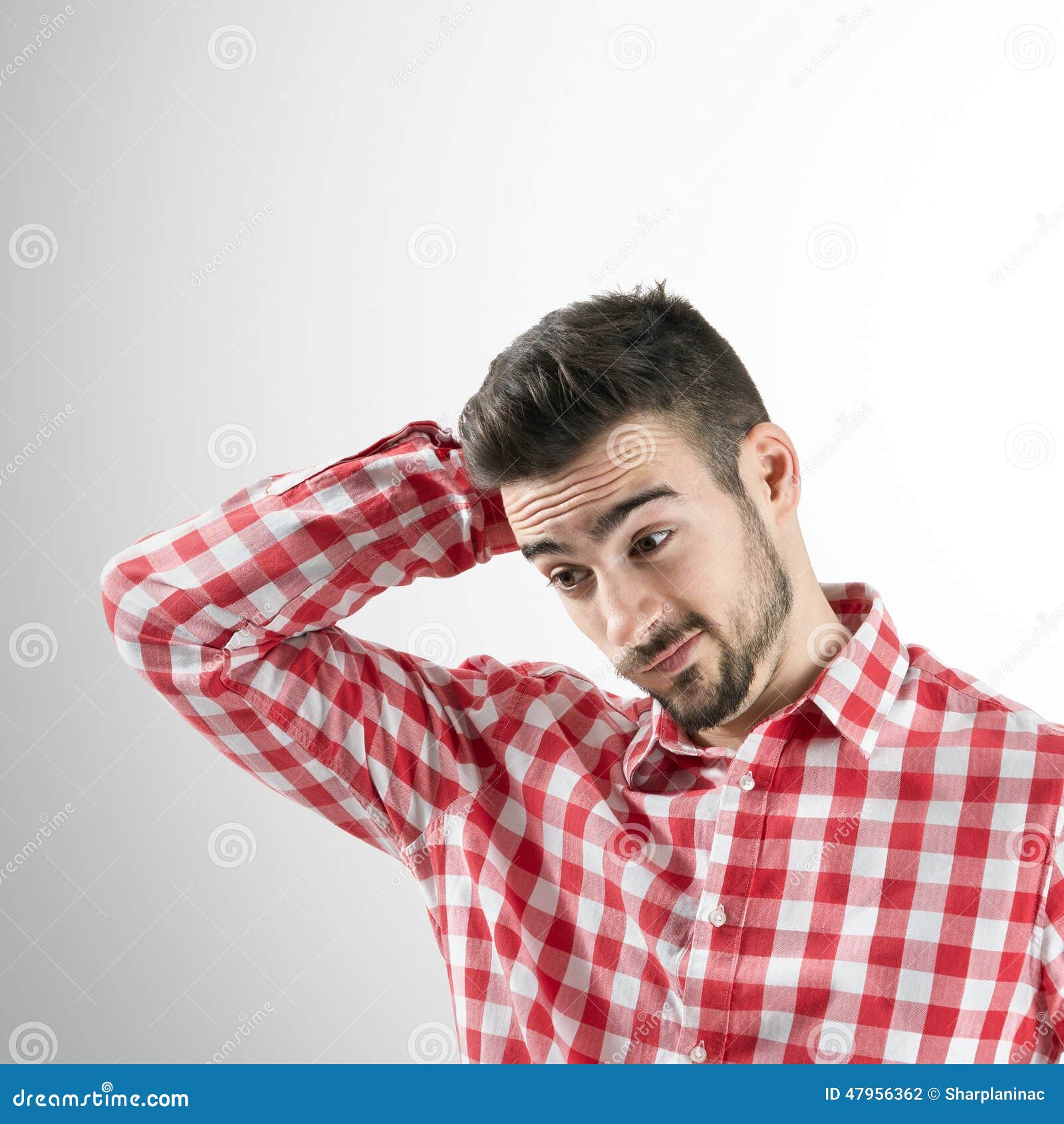 Portrait of Confused Young Bearded Man Looking Down. Stock Photo ... Portrait of Confused Young Bearded Man Looking Down. Stock Photo ...