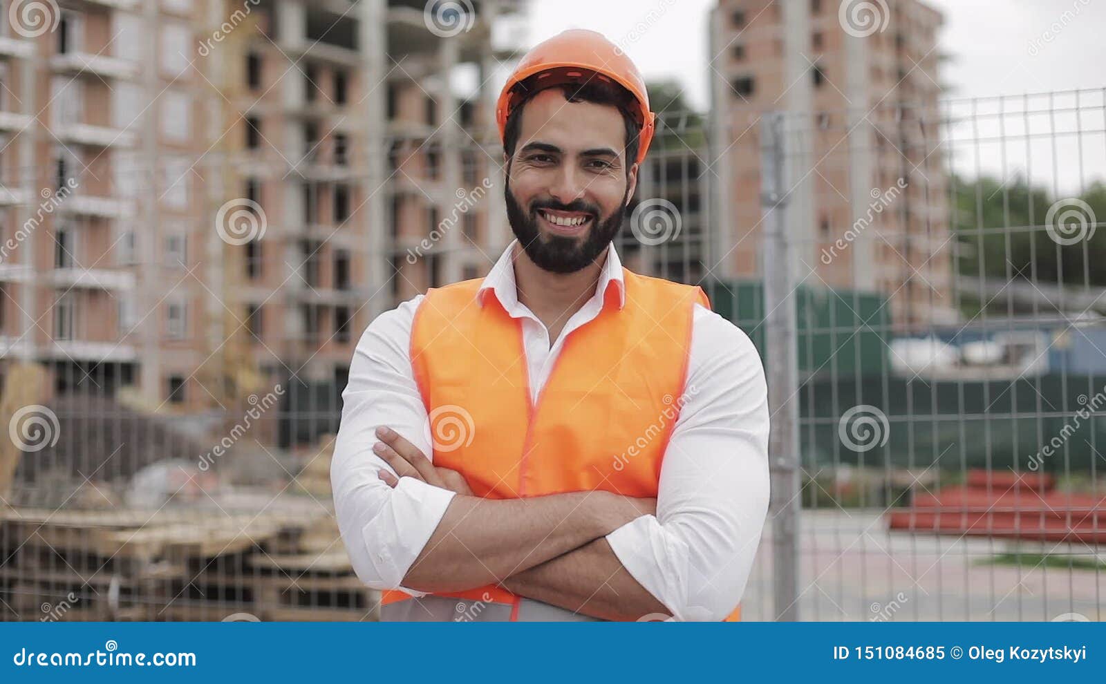 Portrait of Construction Worker on Building Site with Crossed Hands ...