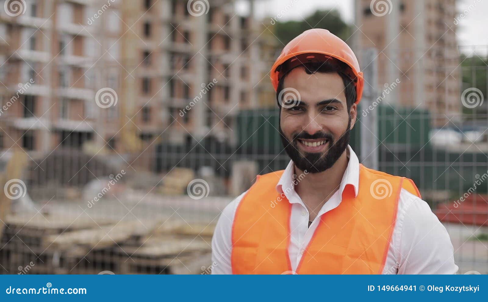Portrait of Construction Worker on Building Site Smiling at the Camera ...