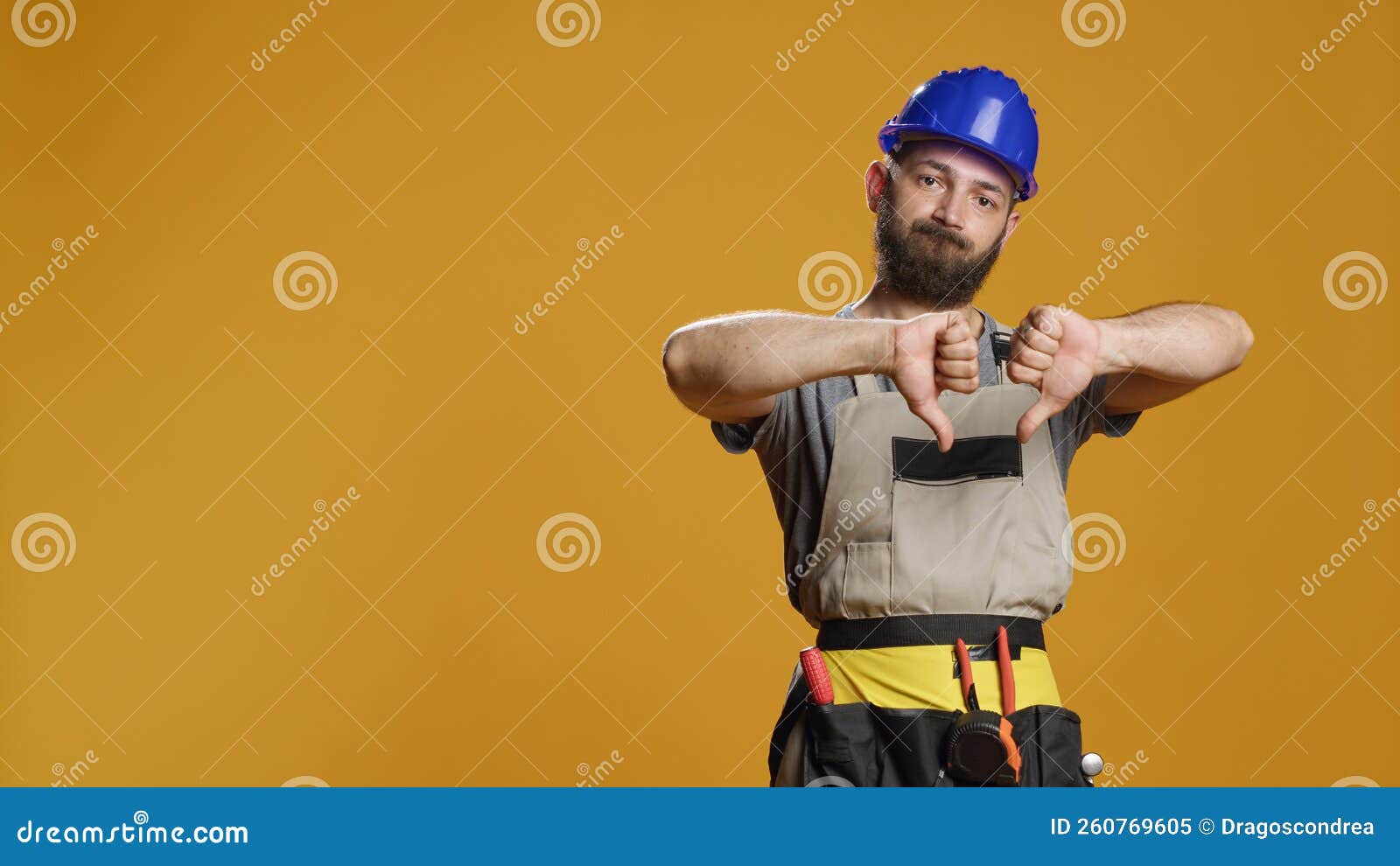 Portrait of Construction Worker Giving Thumbs Down in Studio Stock ...