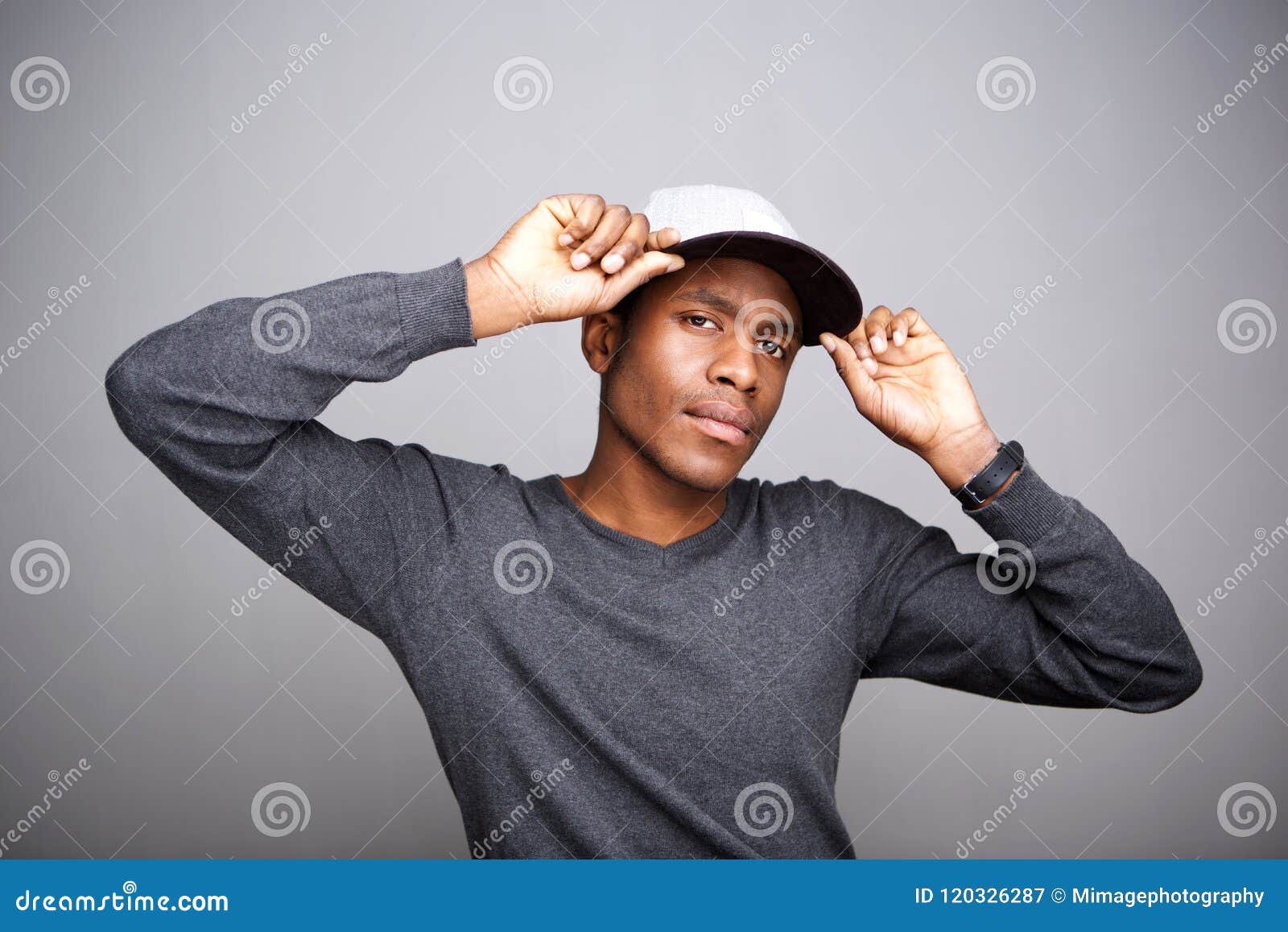 Cool African American Guy Holding Cap Stock Image - Image of ...