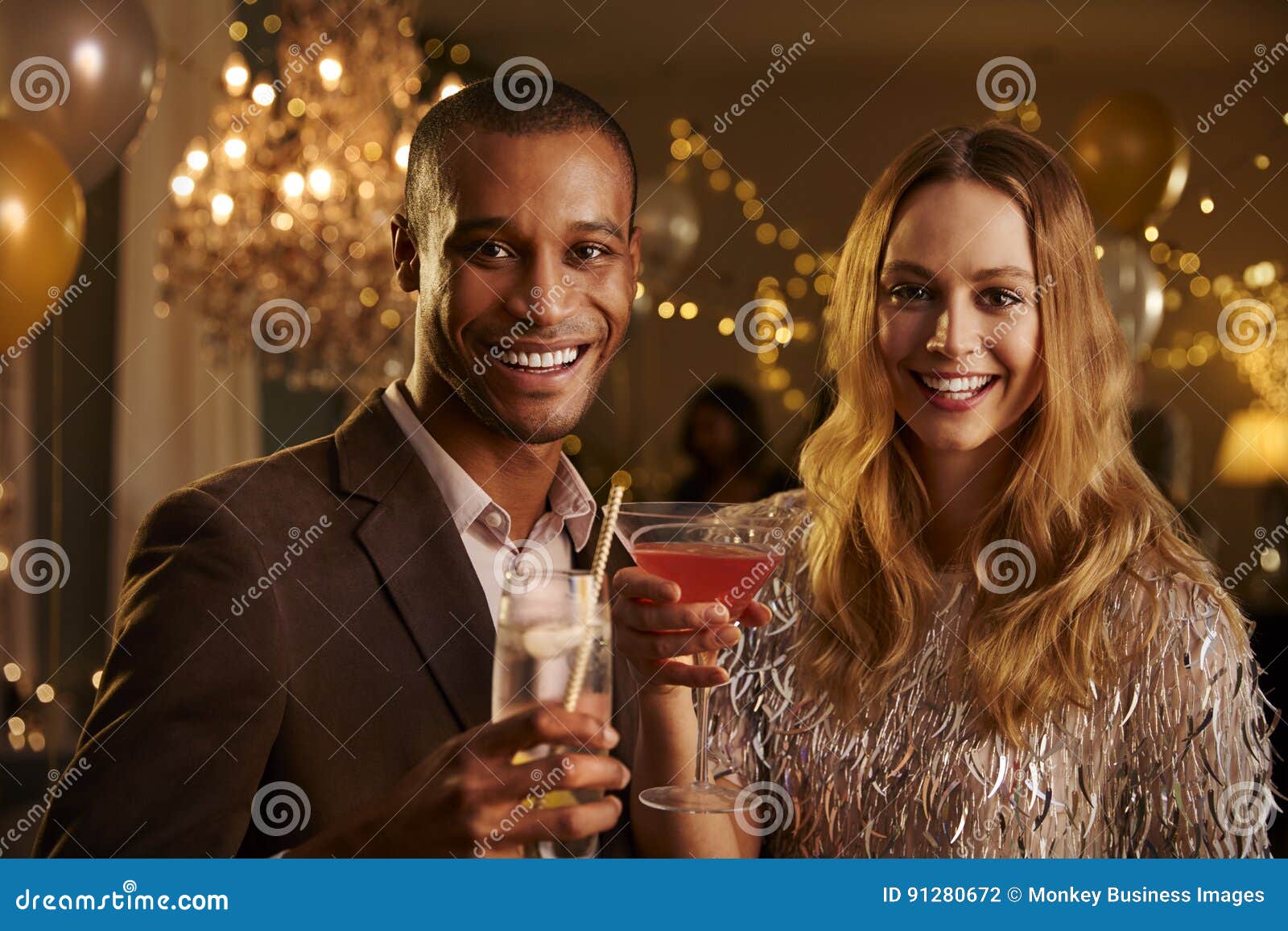 Portrait of Couple with Drinks Enjoying Cocktail Party Stock Photo ...