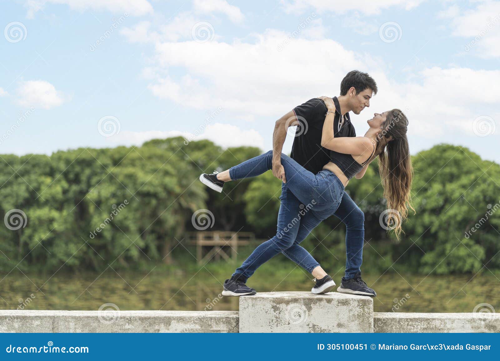 Portrait of Couple of Lovers Dancing Happily on the Railing of the ...