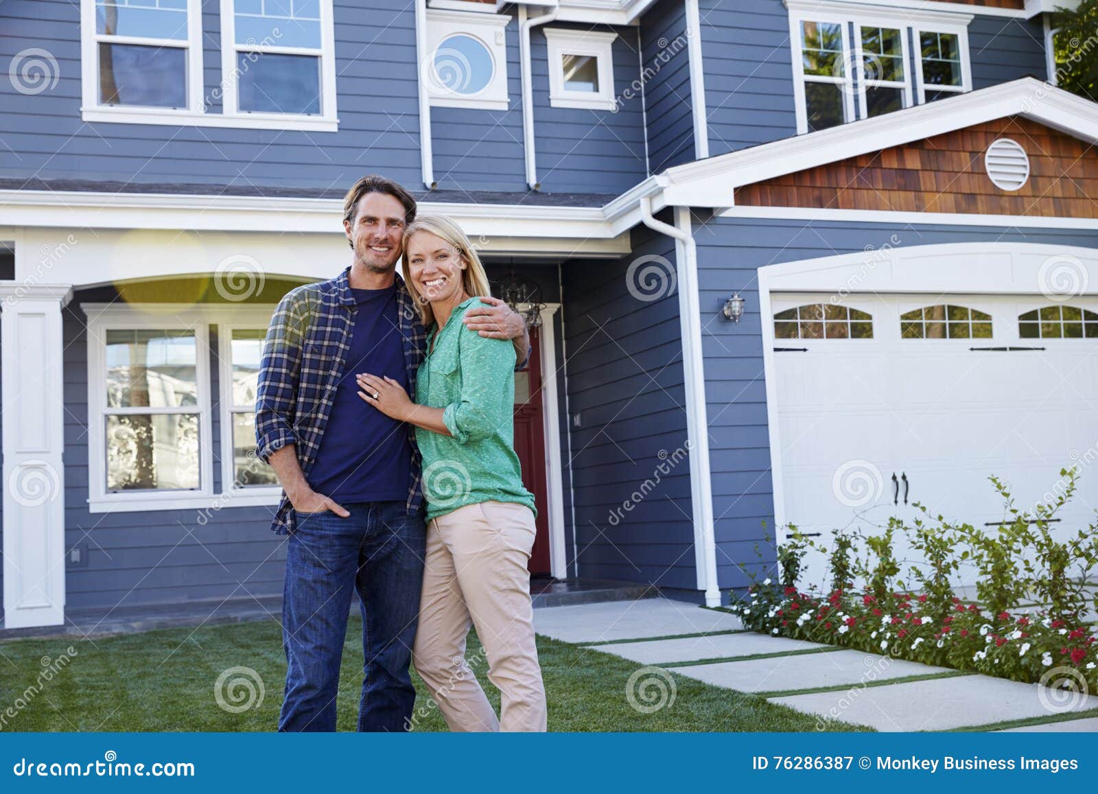Portrait of Couple Standing Outside House Stock Image - Image of ...