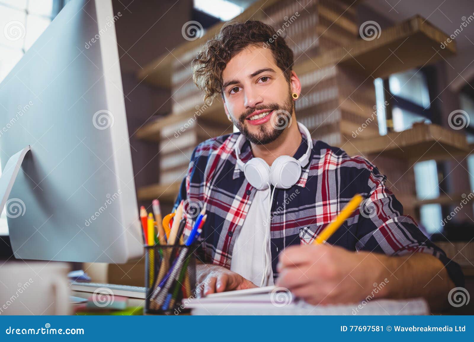 Portrait of Creative Businessman Writing in Spiral Notebook Stock Image ...