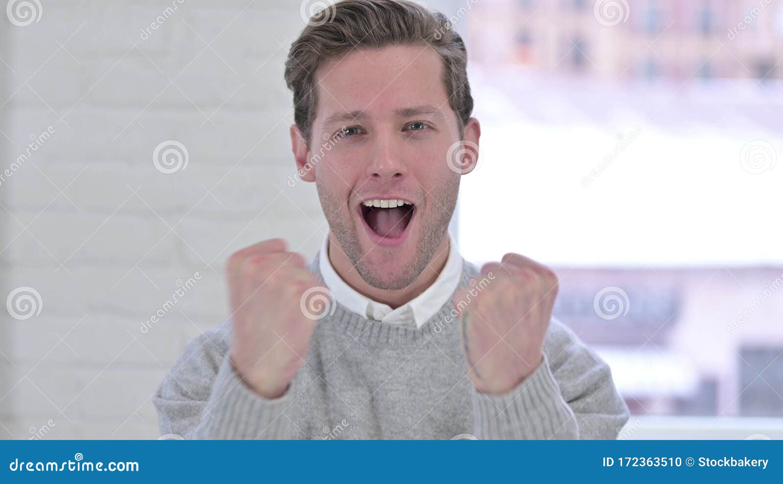 Portrait of Creative Young Man Celebrating Success Stock Photo - Image ...