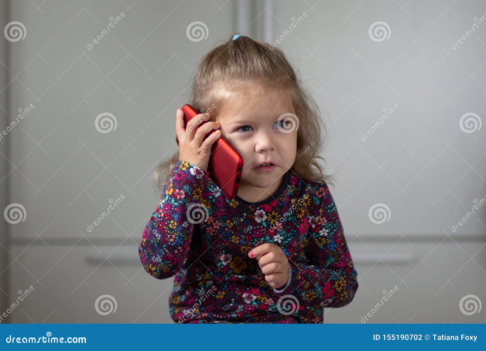 Portrait of Cute and Attractive Child Talking on Mobile Phone Looking ...