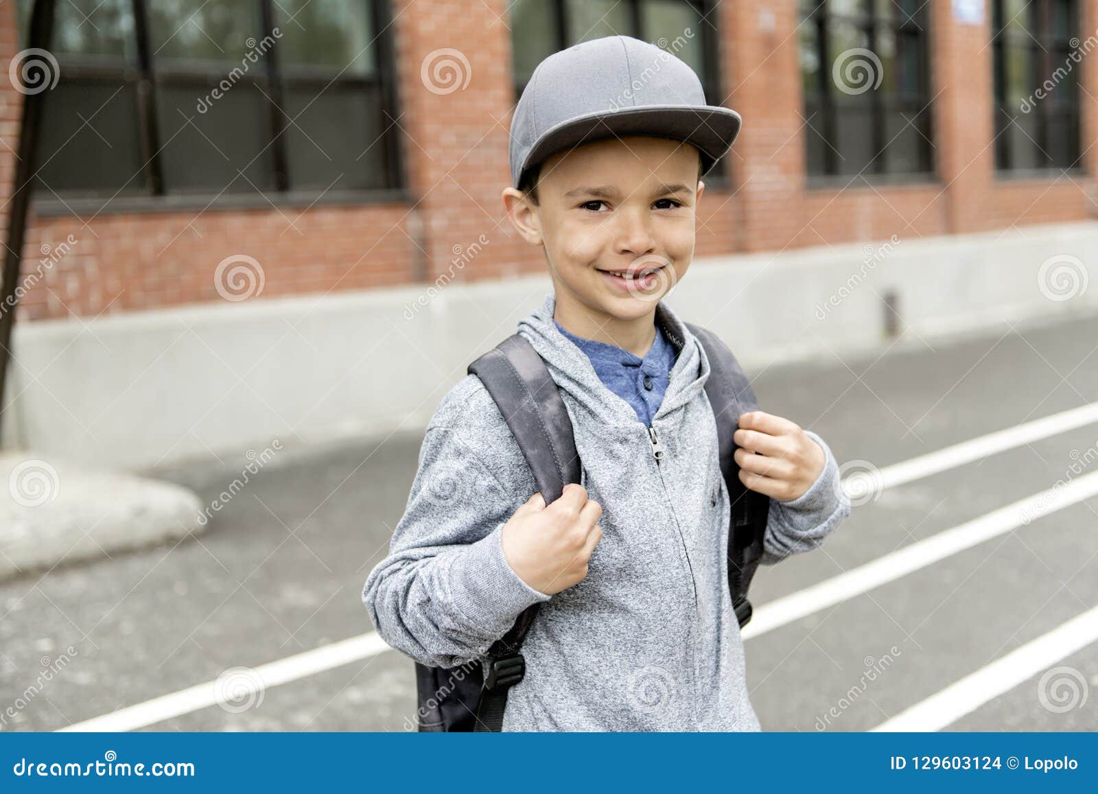 Portrait of Cute Boy with Backpack Outside of School Stock Photo ...