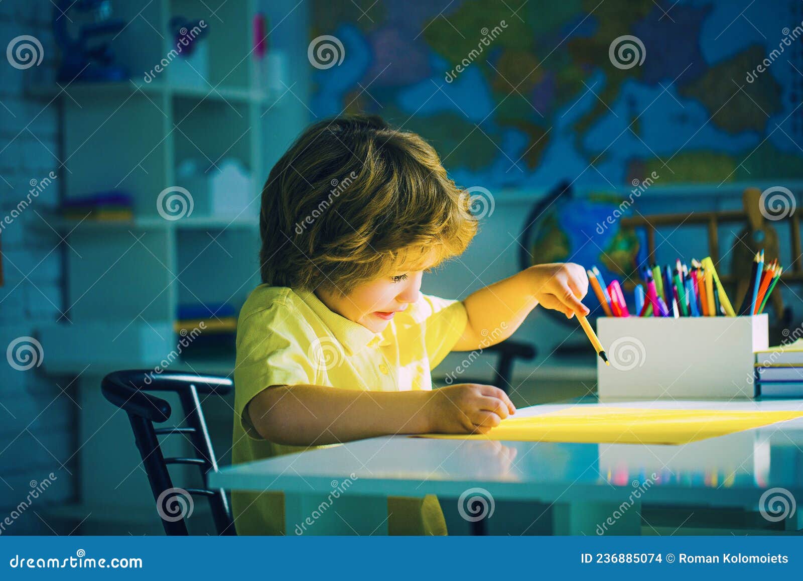 Portrait of a Cute Boy Learning in the Classroom on the Table. Stock ...