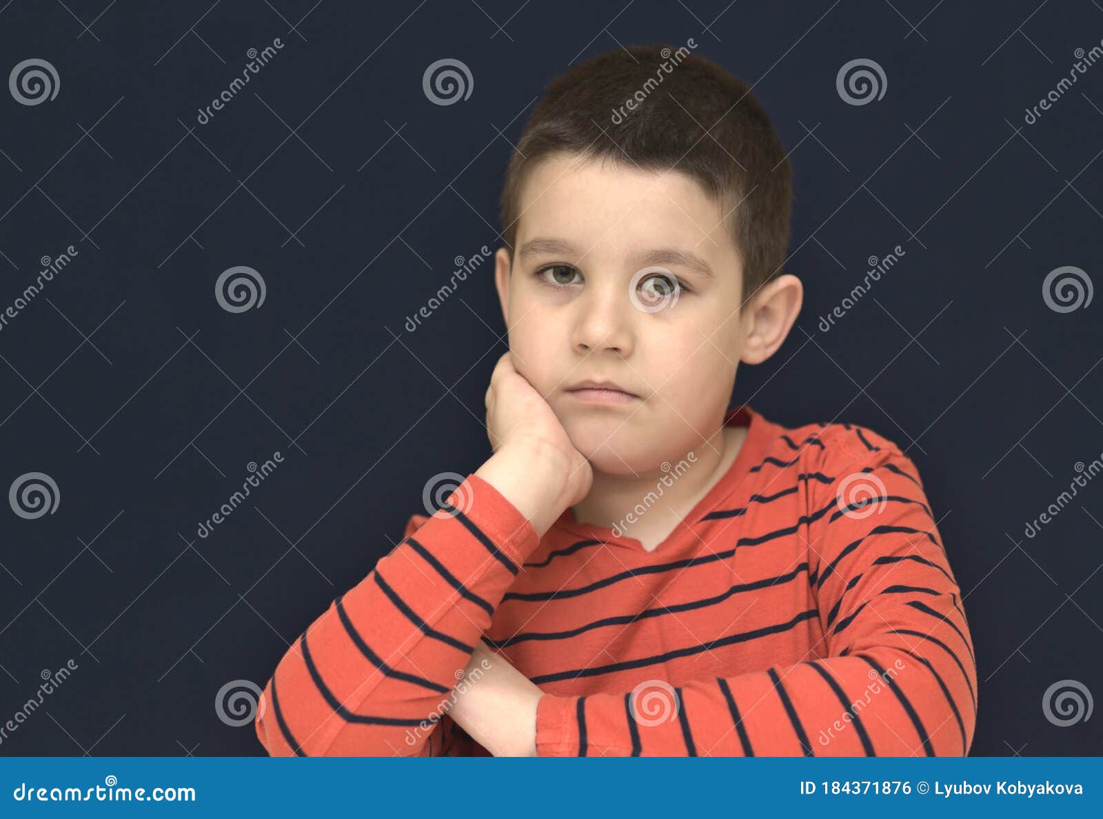 Portrait of a Cute Boy Looking Doubtful. Stock Photo - Image of ...