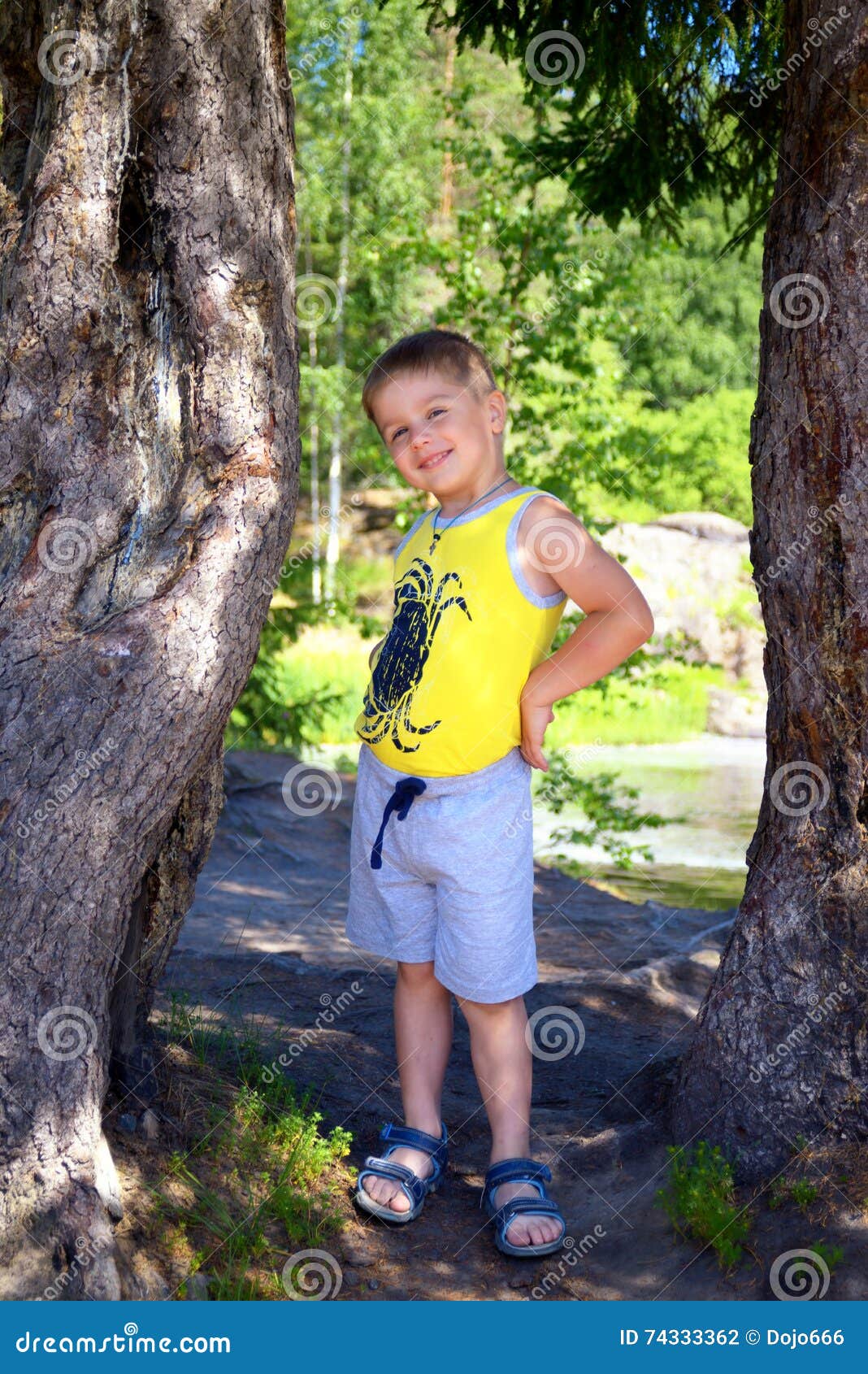 Portrait of a Cute Boy Posing Near Tree Stock Photo - Image of face ...