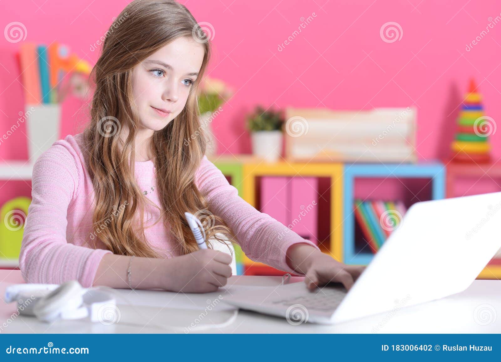 Portrait of Cute Girl Using Laptop at Desk Stock Photo - Image of ...