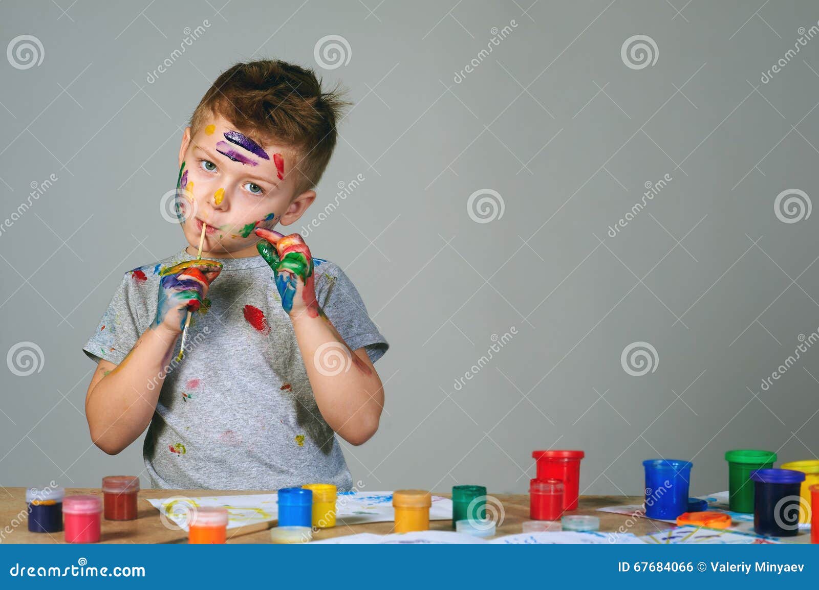 Portrait of a Cute Little Boy Messily Playing with Paints Stock Photo ...