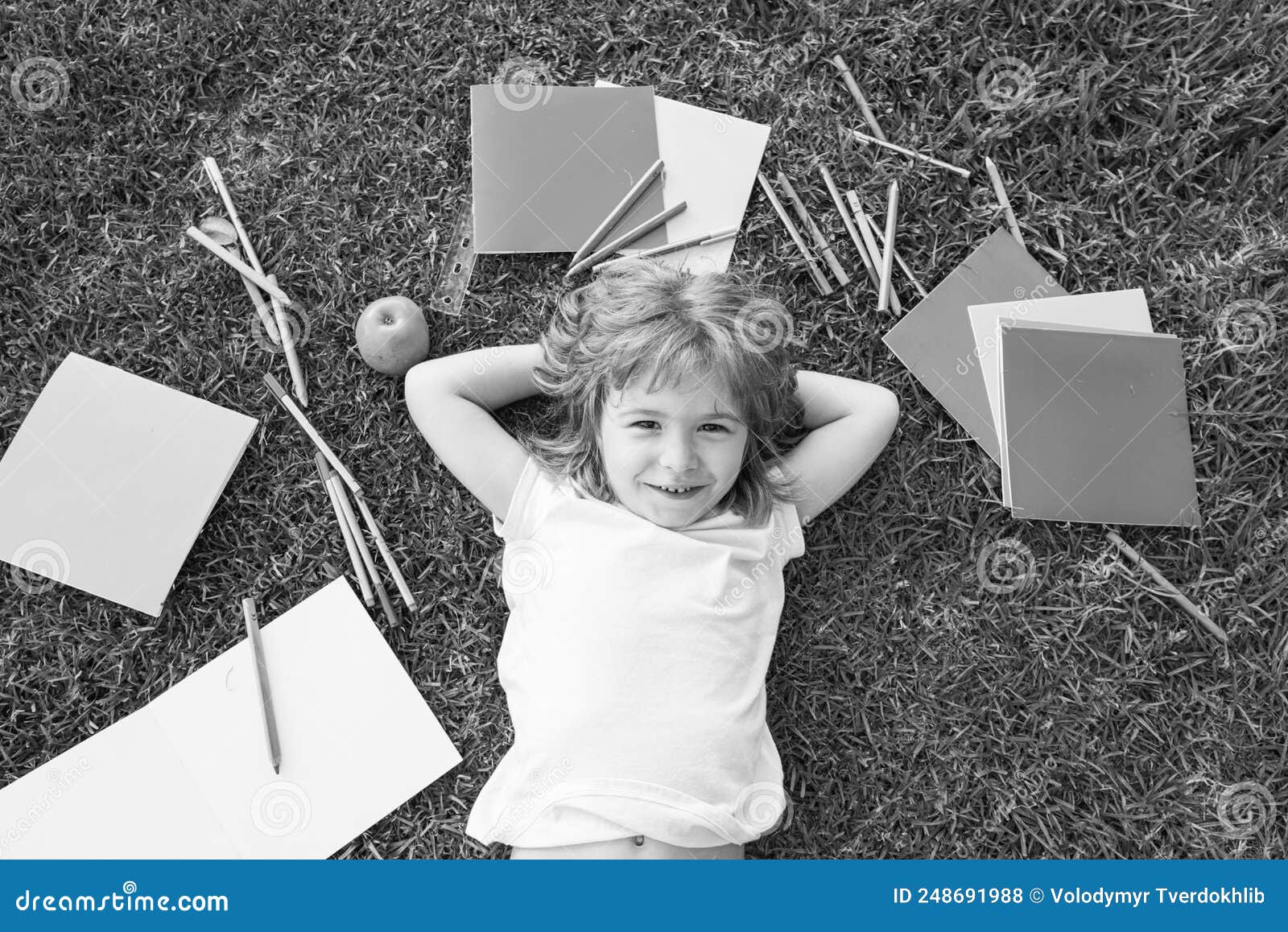 Portrait of Cute Smart Clever School Boy Nerd Doing Homework, Lie on ...