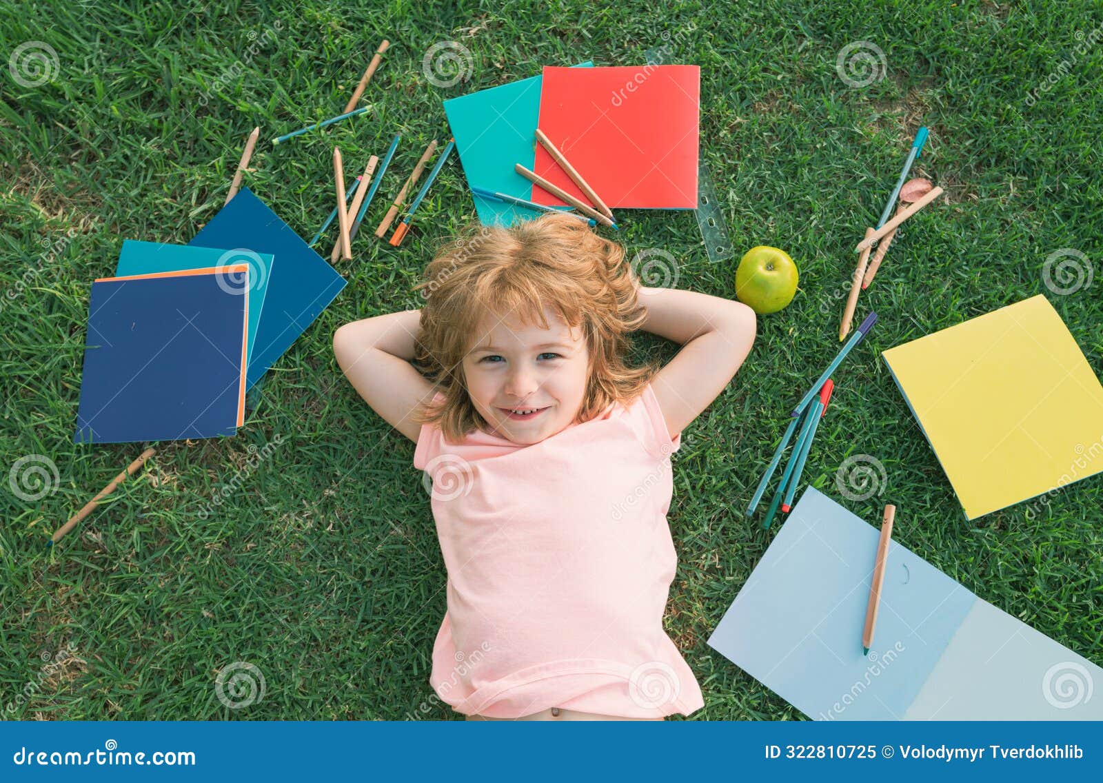 Portrait of Cute Smart Clever School Boy Nerd Doing Homework, Lie on ...