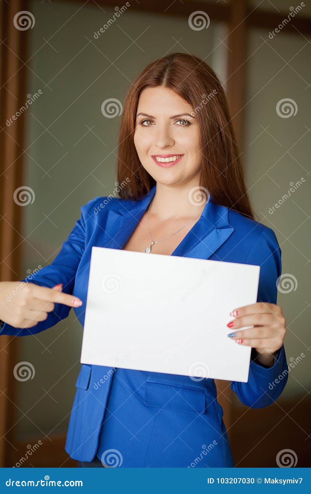 Portrait of a Cute Young Business Woman Smiling, in an Office ... Portrait of a Cute Young Business Woman Smiling, in an Office ...