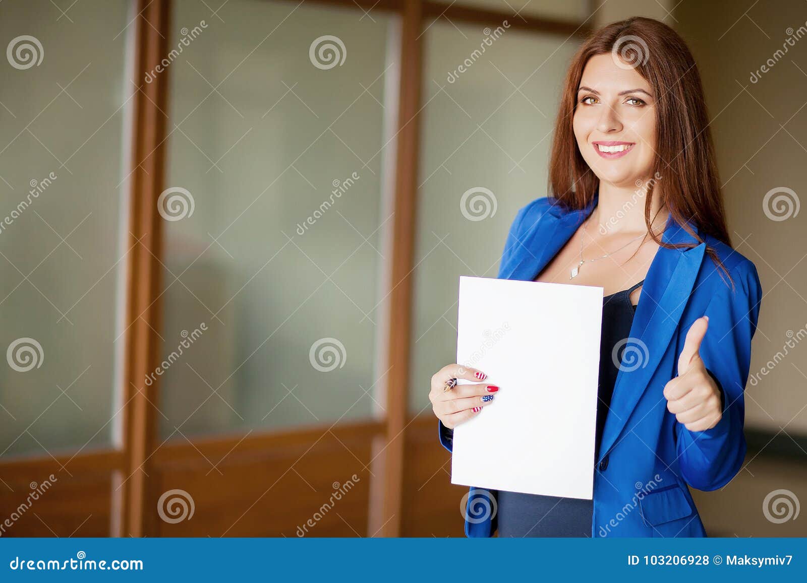 Portrait of a Cute Young Business Woman Smiling, in an Office ... Portrait of a Cute Young Business Woman Smiling, in an Office ...