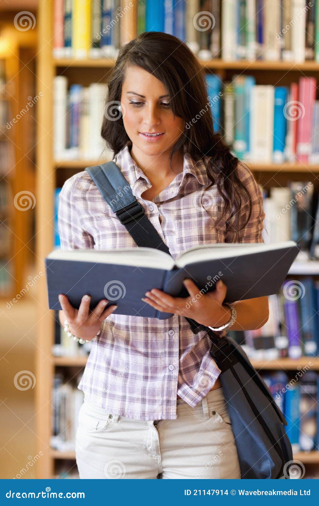 Portrait of a Cute Young Student Reading a Book Stock Photo - Image of ...