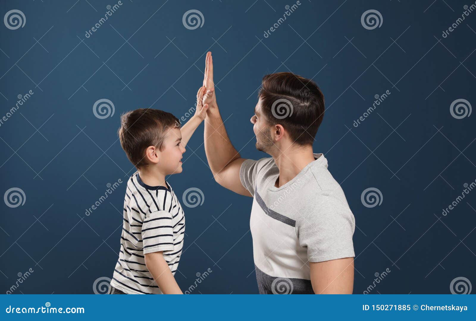 Portrait of Dad and His Son Giving High Five Stock Image - Image of ...