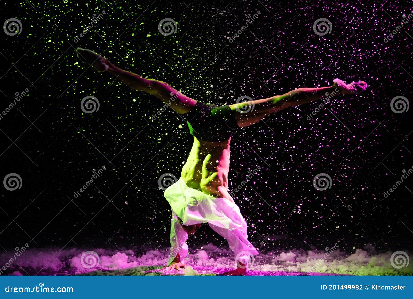 Portrait of a Dancer in an Acrobatic Pose on a Black Background with ...