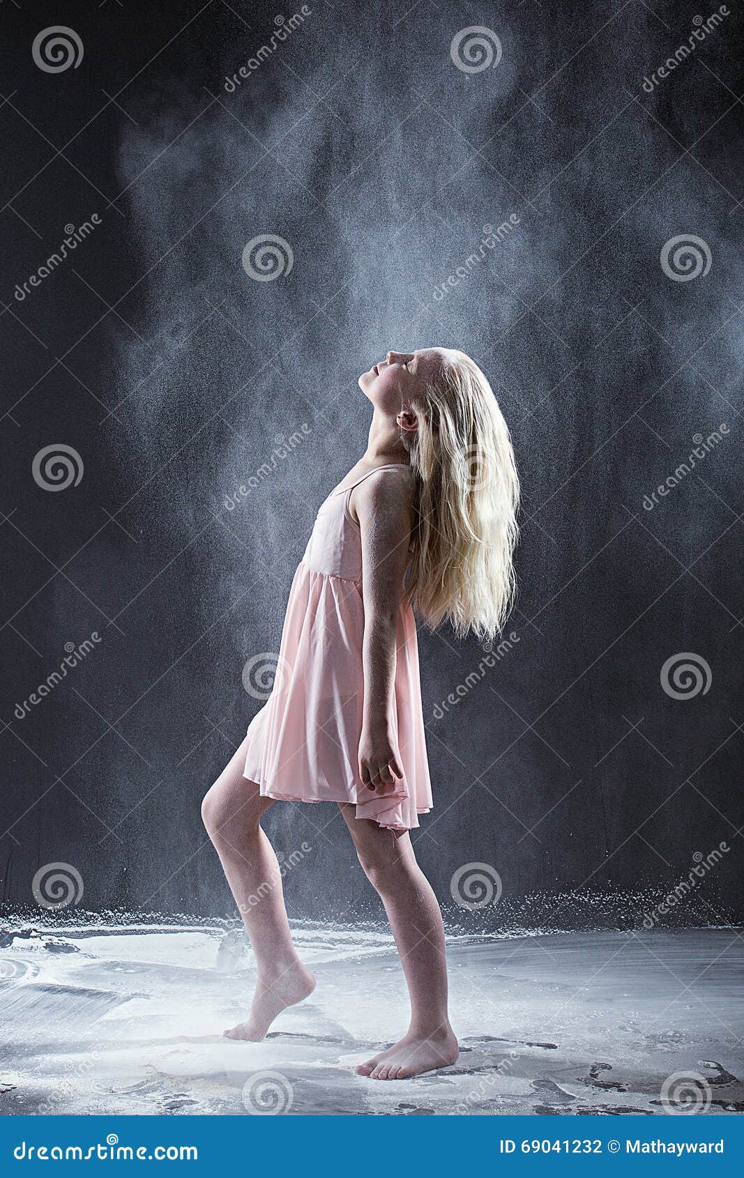 Portrait of Dancer Looking Up with White Powder Floating Down Stock ...