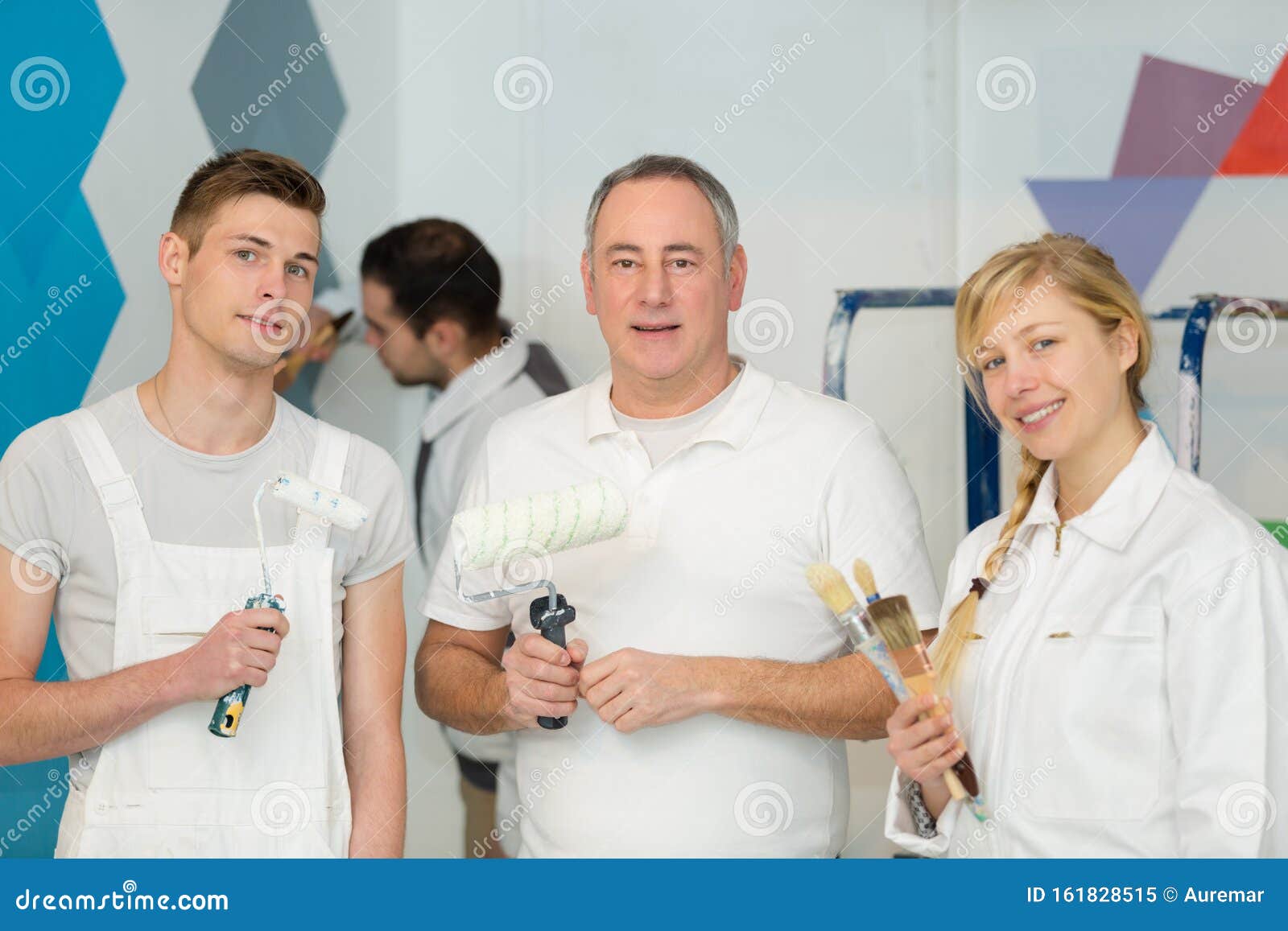 Portrait Decorating Team Holding Brushes and Roller Stock Image - Image ...
