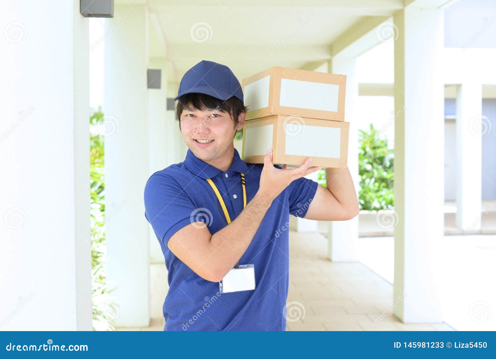 Smiling delivery man stock image. Image of japanese - 145981233