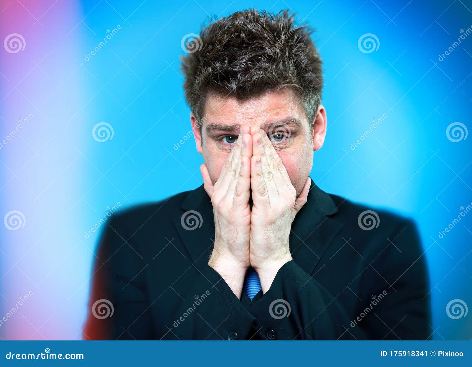 Portrait of a Desperate Businessman on a Blue Background Stock Image ...