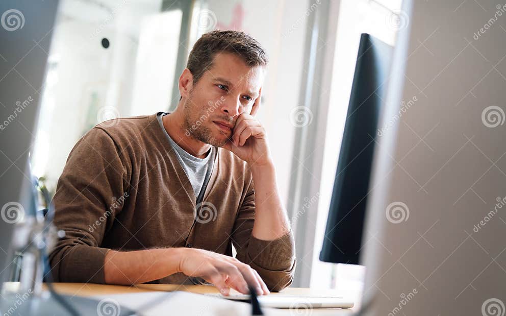 Portrait of a Disappointed Man Programmer Looking Stressed Out while ...