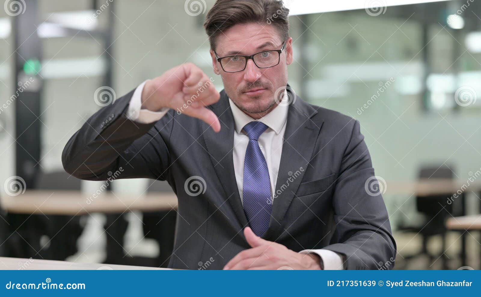 Portrait of Disappointed Middle Aged Businessman Doing Thumbs Down ...