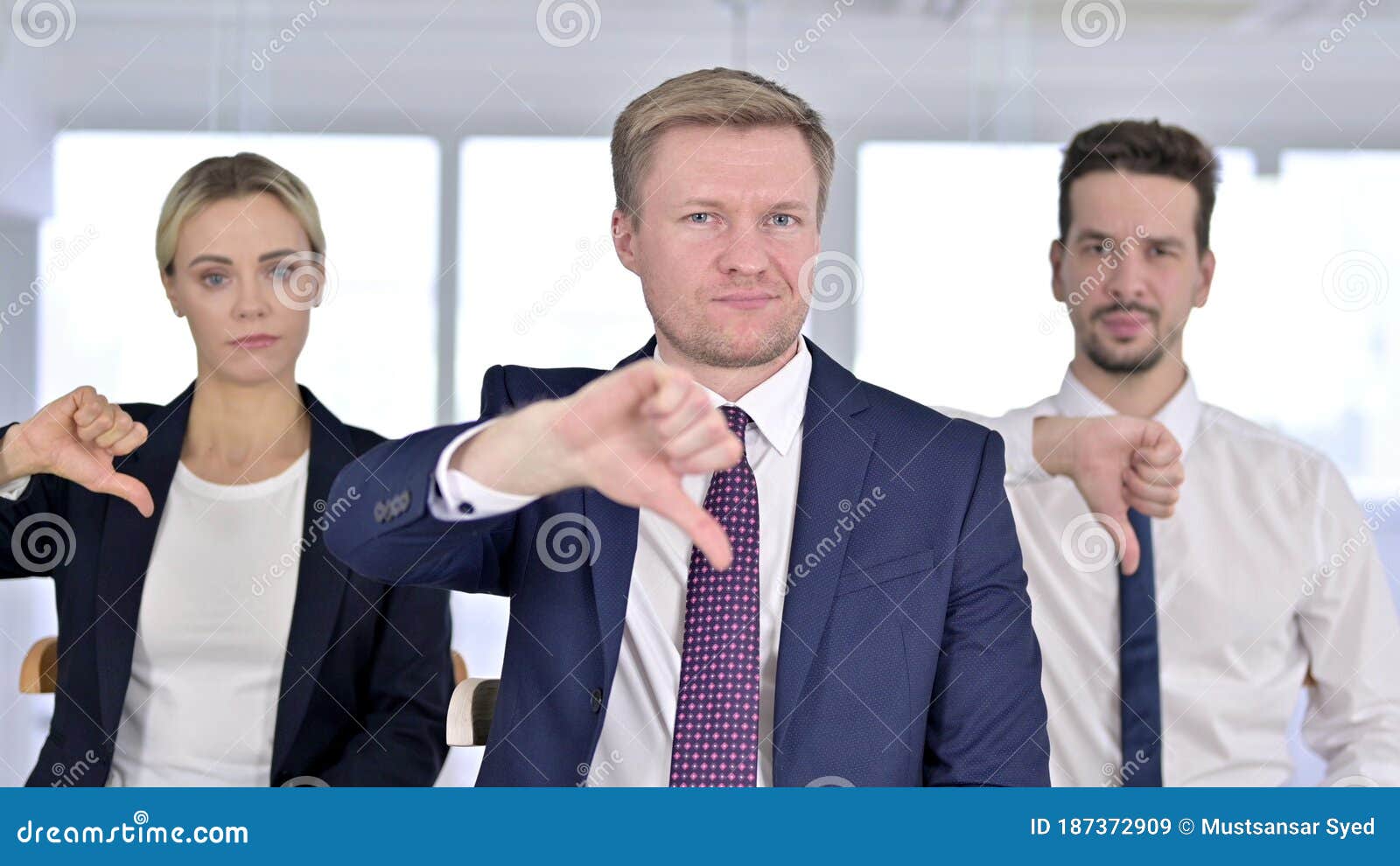 Portrait of Disappointed Professional Team Showing Thumbs Down Stock ...