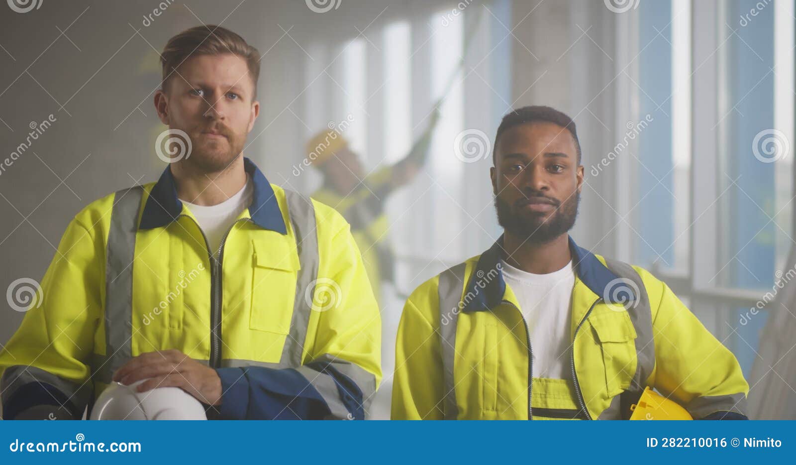 Portrait of Diverse Builders Posing at Camera at Construction Site ...