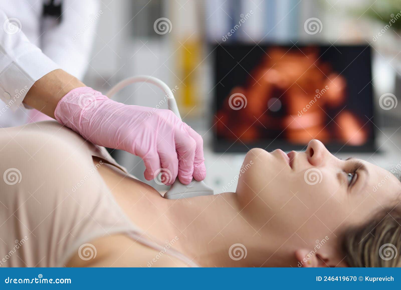 Doctor Endocrinologist Doing Ultrasound Of Thyroid Gland In Clinic