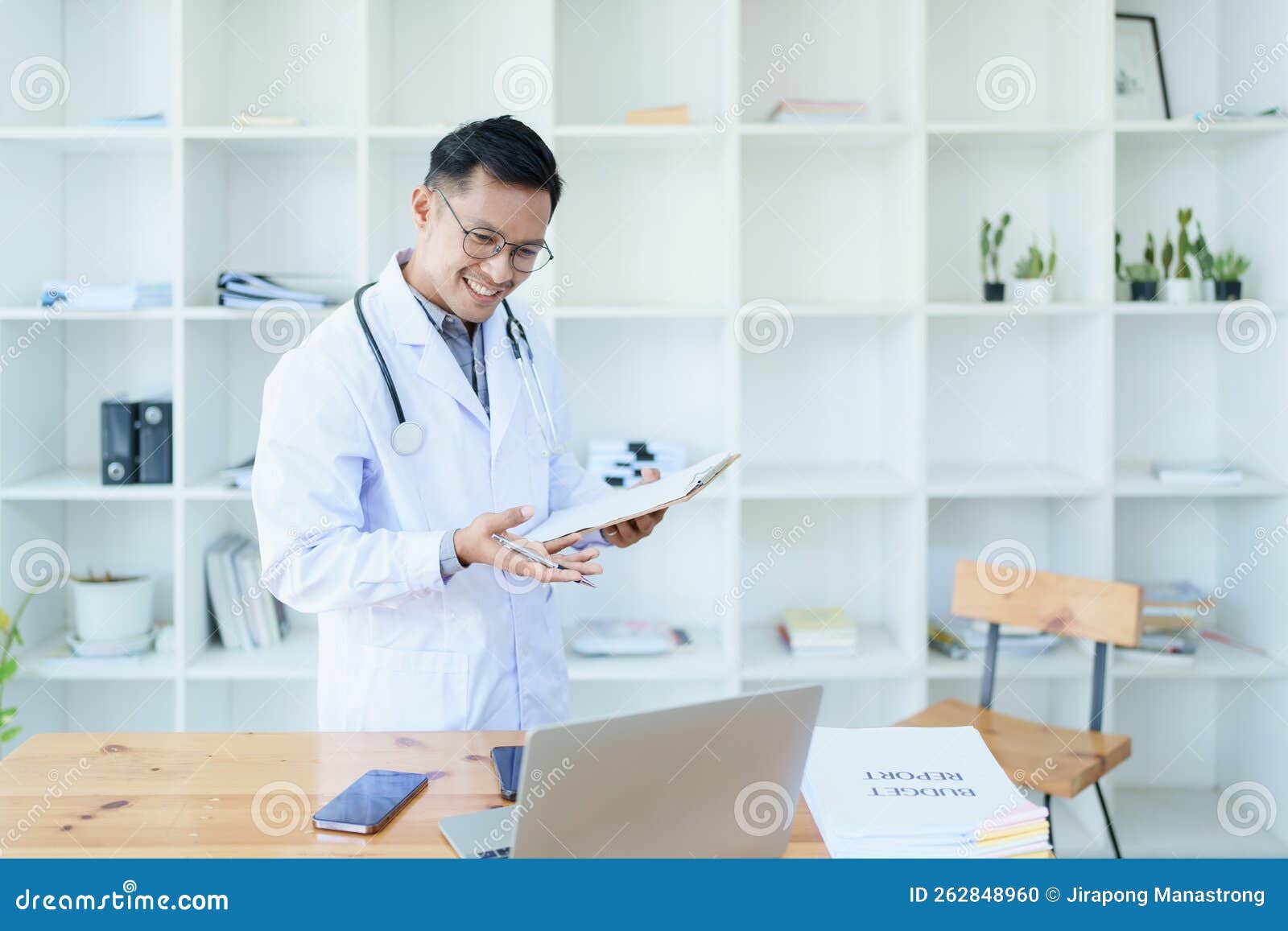 Portrait of a Doctor Looking at a Patient& X27;s Information before ...