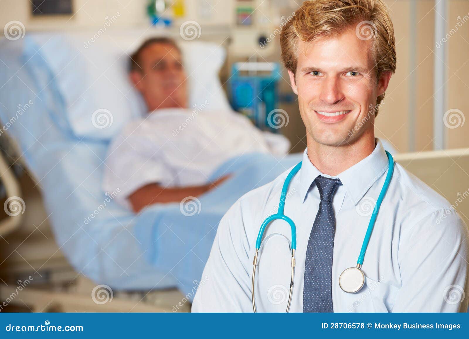 Portrait of Doctor with Patient in Background Stock Photo - Image of ...