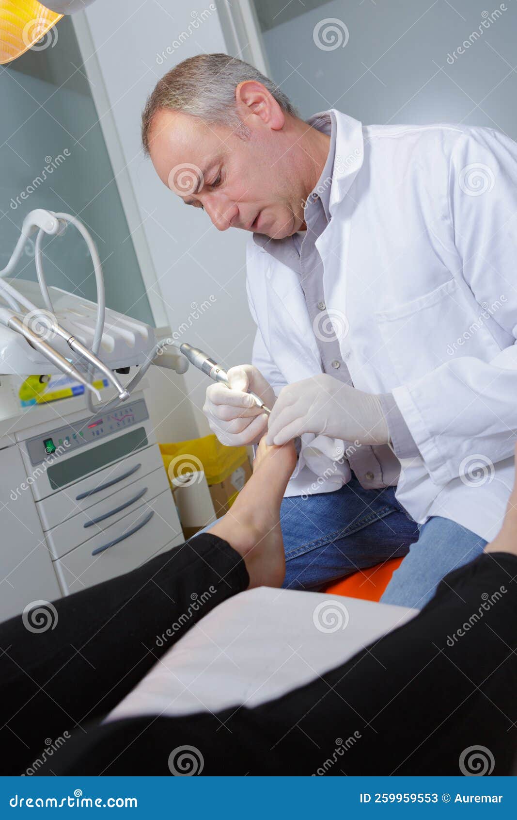 Portrait Doctor Treating Feet Stock Image - Image of treat, feet: 259959553