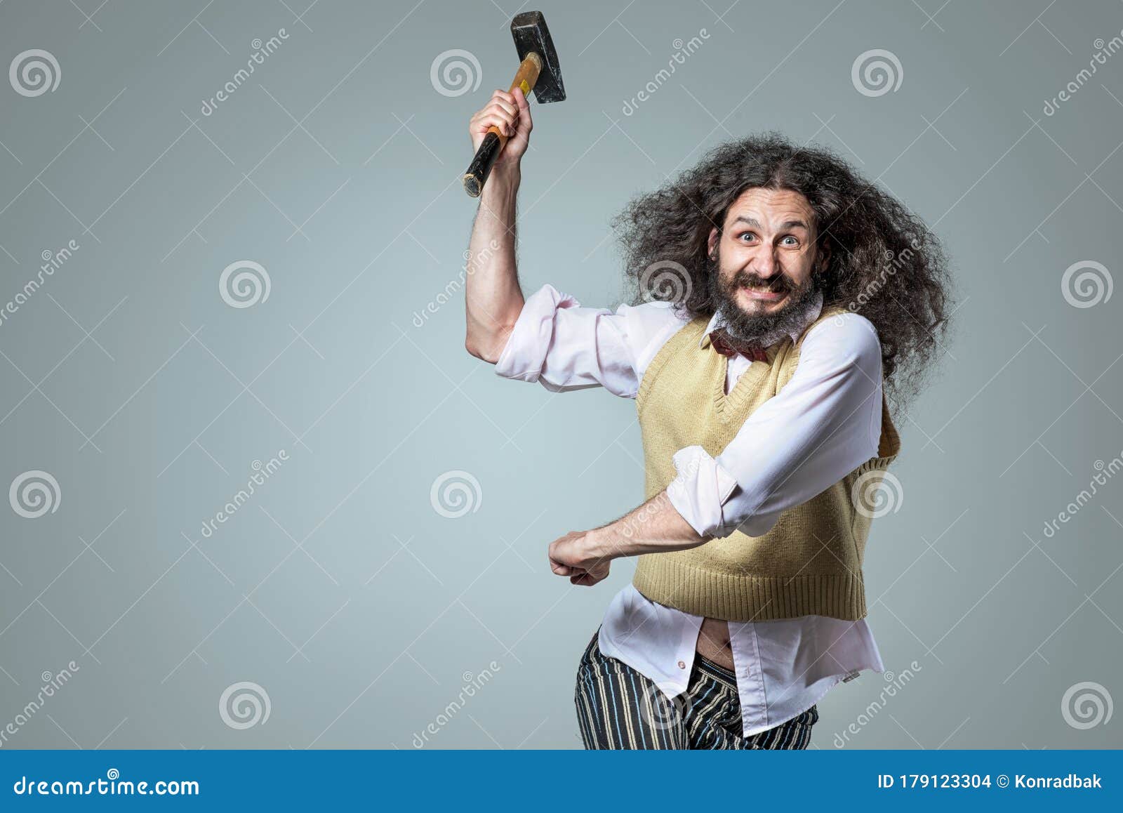Portrait of an Eccentric, Aggresive Man Holding a Hammer Stock Photo ...