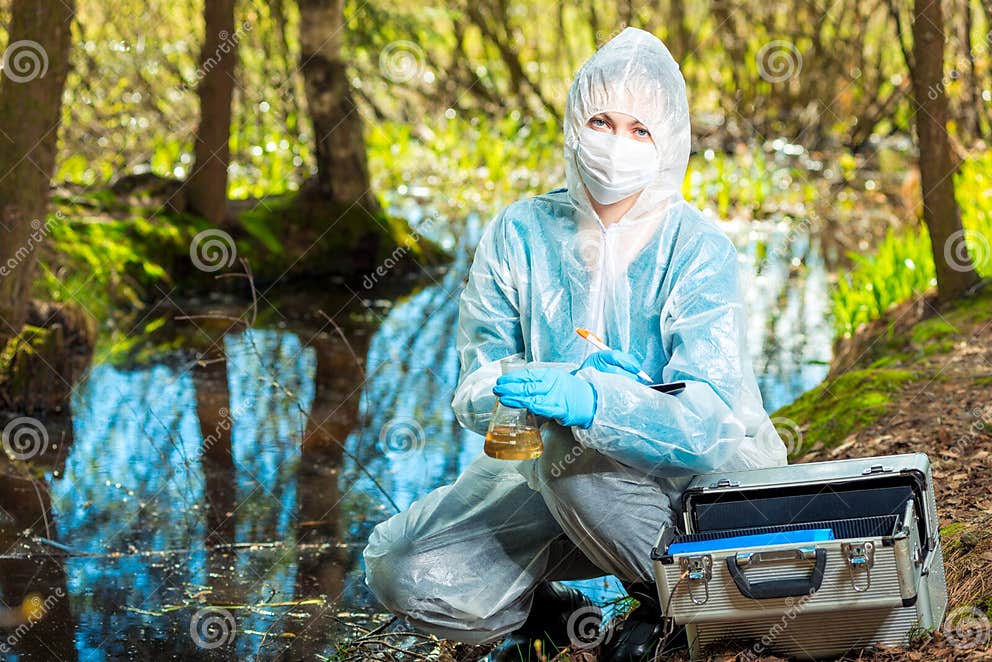 Portrait of an Ecologist in Protective Clothing while Working, Taking ...