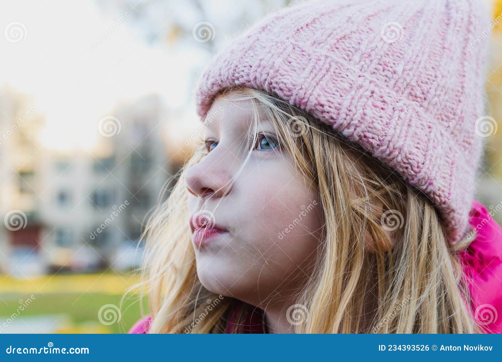Portrait of an Eight-year-old Girl with Disheveled Hair on the Street ... Portrait of an Eight-year-old Girl with Disheveled Hair on the Street ...