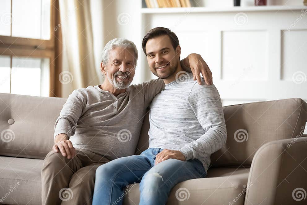 Portrait Of Elderly Father Hugging With Adult Son Stock Image Image