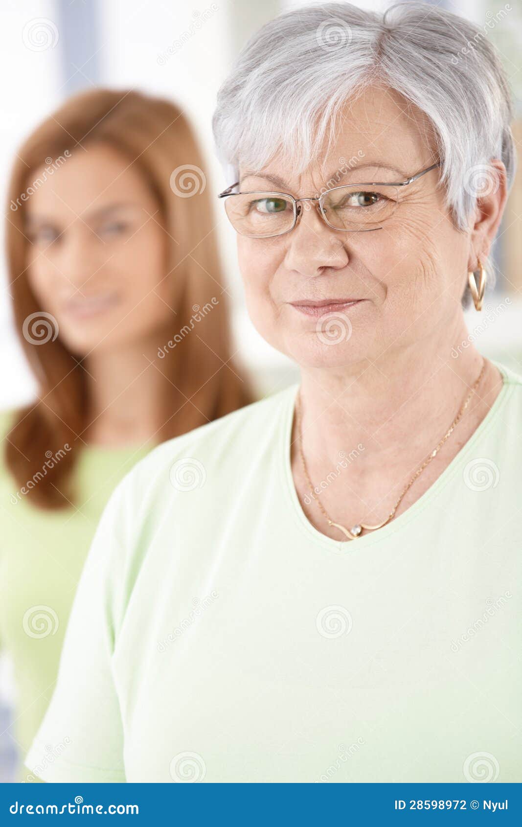 Elderly Female Leaning On Walking Stick, Sitting On Bench In Nursing ...