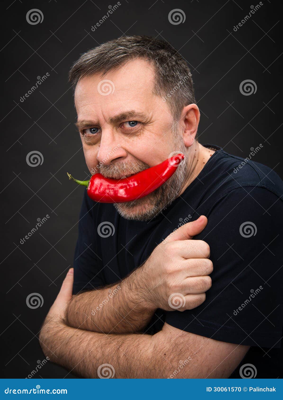 Elderly Man with Red Pepper in His Mouth Stock Photo - Image of ...