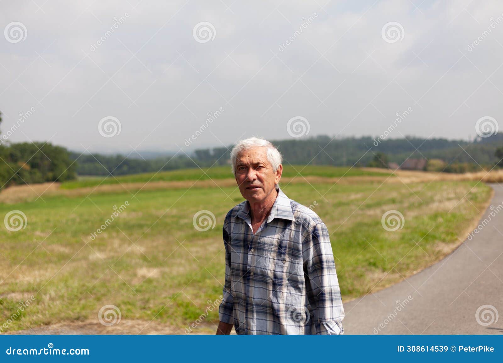 Portrait of an Elderly Man Standing on the Road in the Countryside ...