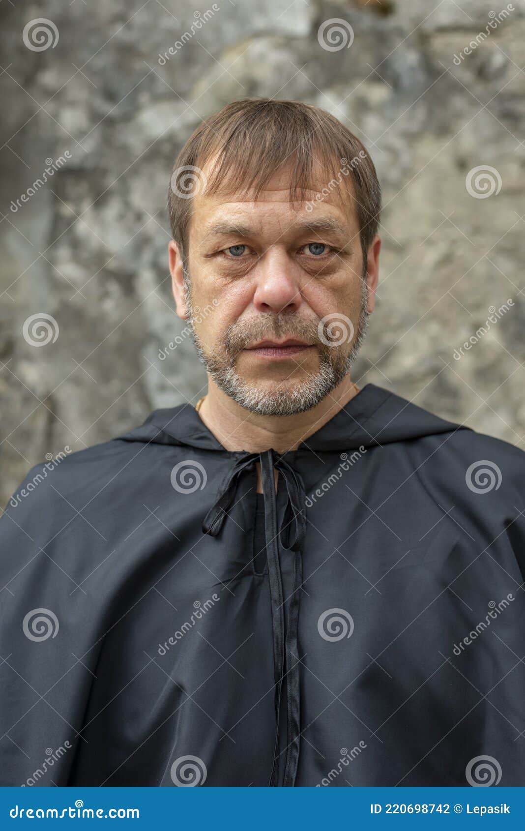 Portrait of an Elderly Monk 45-50 Years Old with a Beard in a Black ...
