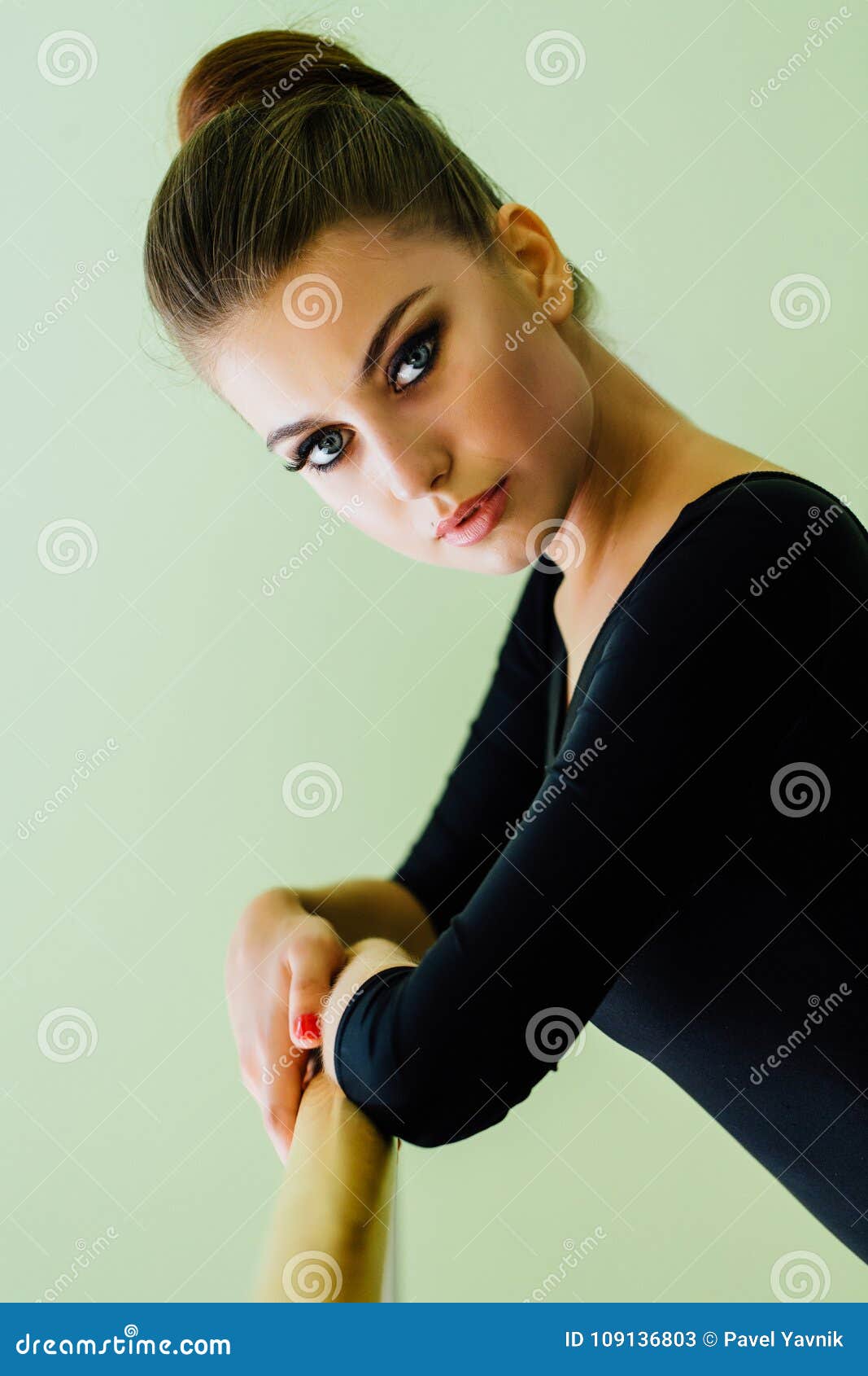 Elegant Beautiful Ballerina With A Perfect Body Doing Stretching