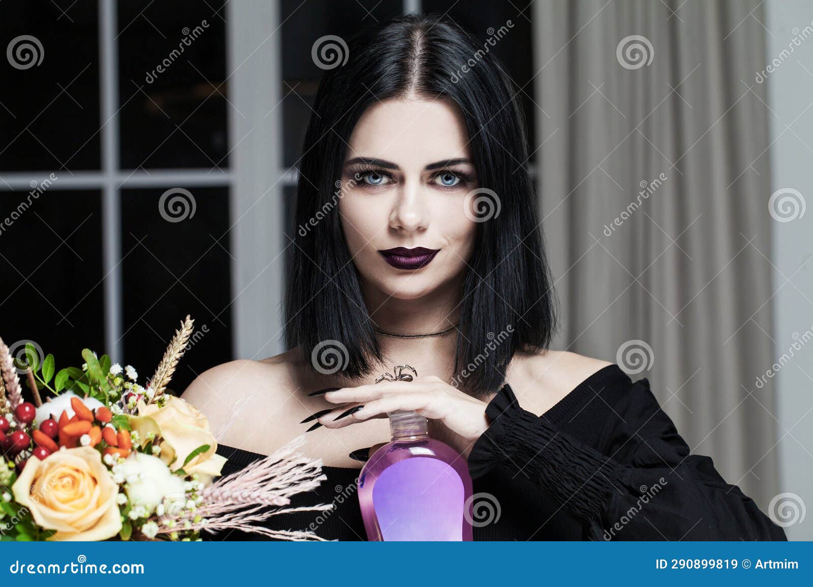 Portrait Of Elegant Stylish Brunette Gothic Witch Woman Holding Bottle