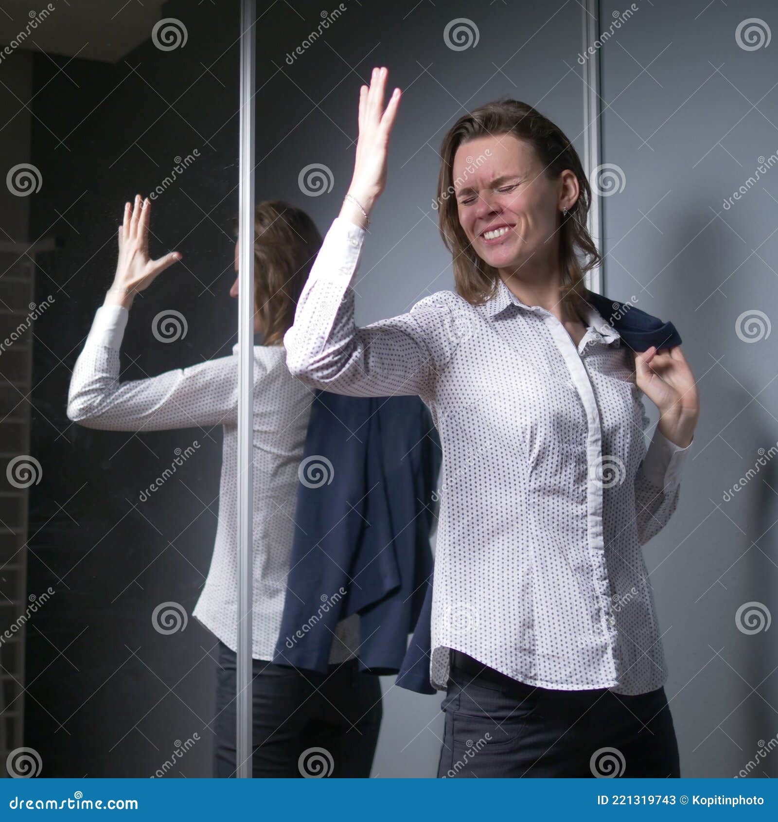 Portrait of an Emotional Business Woman Taking Off Her Jacket, Smiling ... Portrait of an Emotional Business Woman Taking Off Her Jacket, Smiling ...