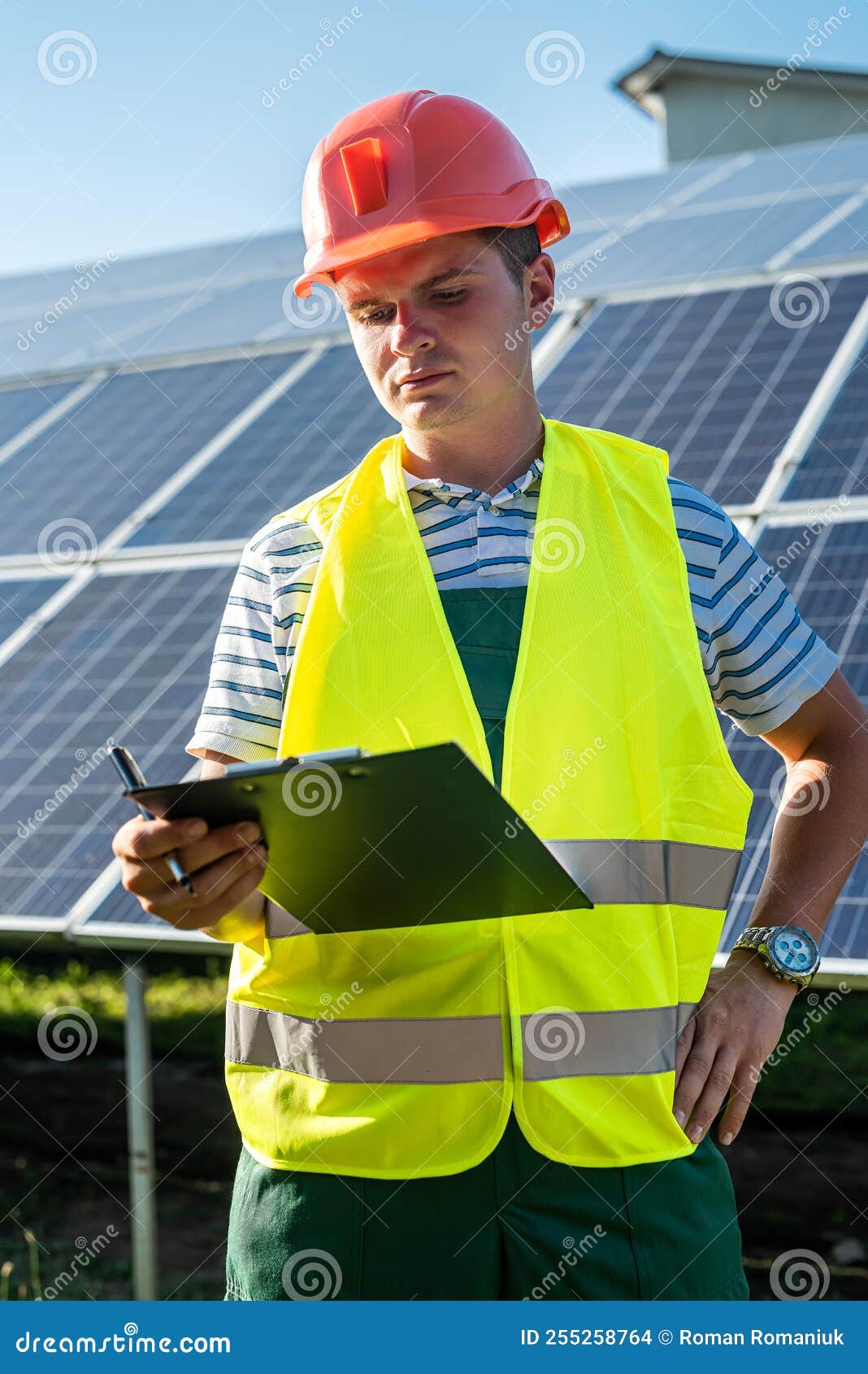 Portrait of Engineer with Blueprints Posing Near Solar Panels Stock ...