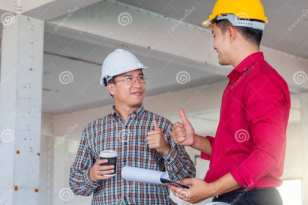 Portrait of Engineer Checking the Job and Talking about Project with ...